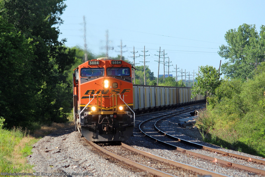 BNSF 5884 heads sb with a loaded ucex coal train.